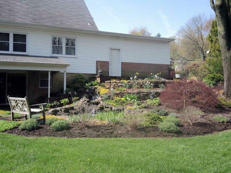 Transforming a Hillside into Pond and Waterfall - Claire Jones Landscapes
